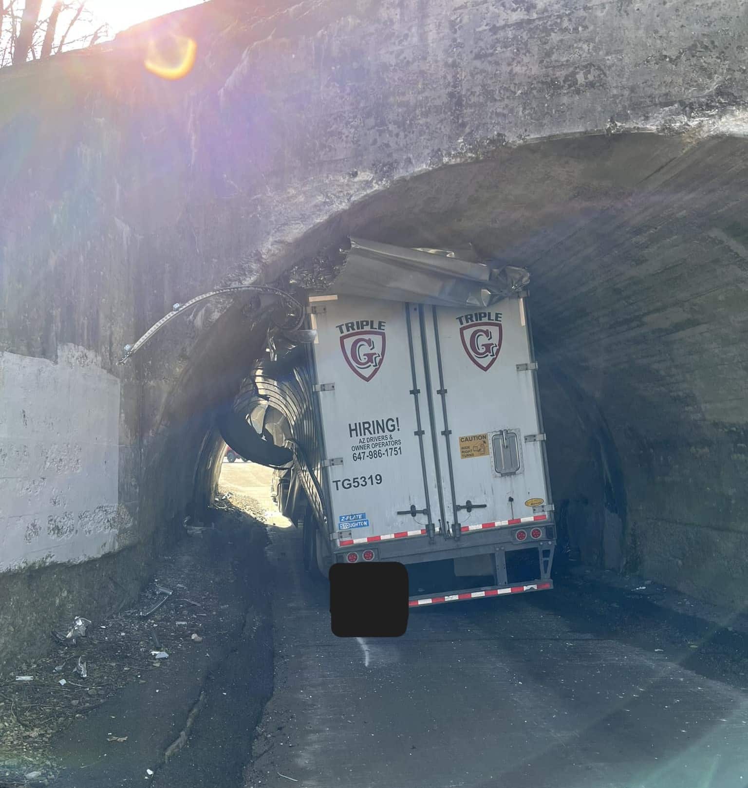 Semitruck trailer wedged underneath railroad tunnel in Pendleton County ...